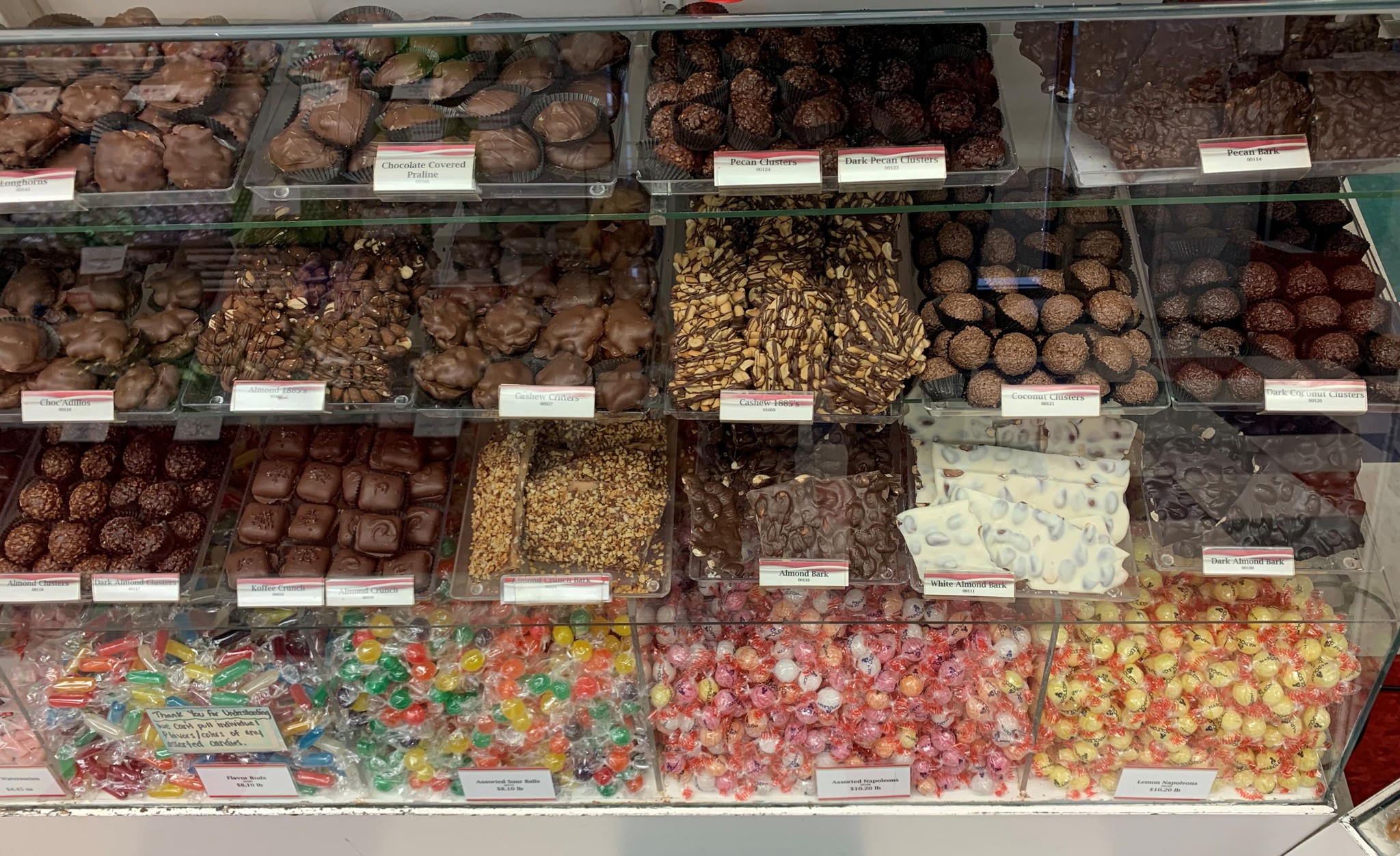 A display case showing thirty types of candies