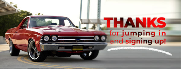 Red muscle car on a paved road | Thanks for jumping in and signing up!